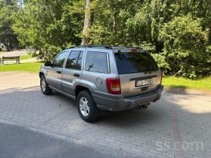 Pelēks Jeep Grand Cherokee 2000 Rīga, ar dzinēja tilpumu 4.70 L un nobraukumu 197 tūkst. km par 4300 €, foto 5 vietnē AUTOMOTO.COM.LV