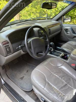 Pelēks Jeep Grand Cherokee 2000 Rīga, ar dzinēja tilpumu 4.70 L un nobraukumu 197 tūkst. km par 4300 €, foto 7 vietnē AUTOMOTO.COM.LV