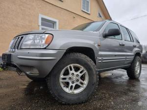 Grey Jeep Grand Cherokee 2002 in Rokiskis, with an engine capacity of 2.69 L and mileage of 240 thousand km for 2299 €, photo 5 on AUTOMOTO.COM.LV