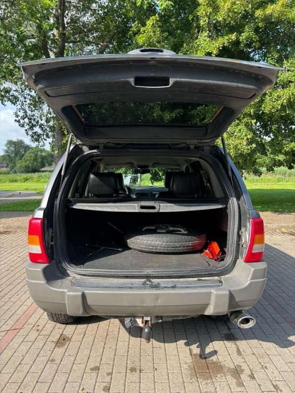 Grey Jeep Grand Cherokee 2002 in Taurage, with an engine capacity of 3.95 L and mileage of 2 thousand km for 3300 €, photo 8 on AUTOMOTO.COM.LV