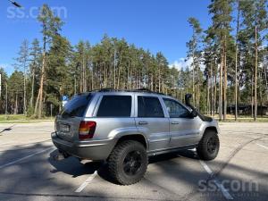 Grey Jeep Grand Cherokee 2003 in Riga, with an engine capacity of 2.70 L and mileage of 306 thousand km for 3950 €, photo 4 on AUTOMOTO.COM.LV