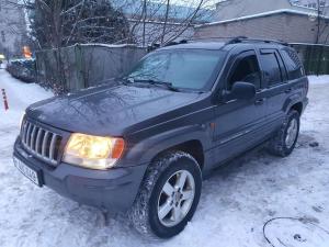Pelēks Jeep Grand Cherokee 2004 Kauņa, ar dzinēja tilpumu 2.70 L un nobraukumu 263 tūkst. km par 2950 €, foto  vietnē AUTOMOTO.COM.LV