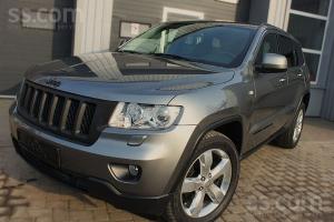 Pelēks Jeep Grand Cherokee 2012 Rīga, ar dzinēja tilpumu 3.00 L un nobraukumu 0 tūkst. km par 10990 €, foto  vietnē AUTOMOTO.COM.LV