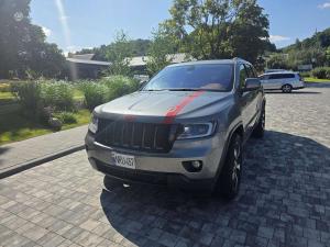 Grey Jeep Grand Cherokee 2013 in Kaunas, with an engine capacity of 5.70 L and mileage of 204 thousand km for 11500 €, photo  on AUTOMOTO.COM.LV
