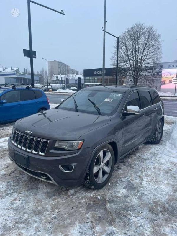 Grey Jeep Grand Cherokee 2014 in Vilnius, with an engine capacity of 5.65 L and mileage of 225 thousand km for 7190 €, photo 1 on AUTOMOTO.COM.LV