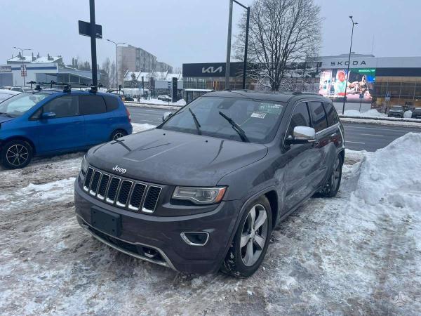 Grey Jeep Grand Cherokee 2014 in Vilnius, with an engine capacity of 5.65 L and mileage of 225 thousand km for 7190 €, photo 4 on AUTOMOTO.COM.LV