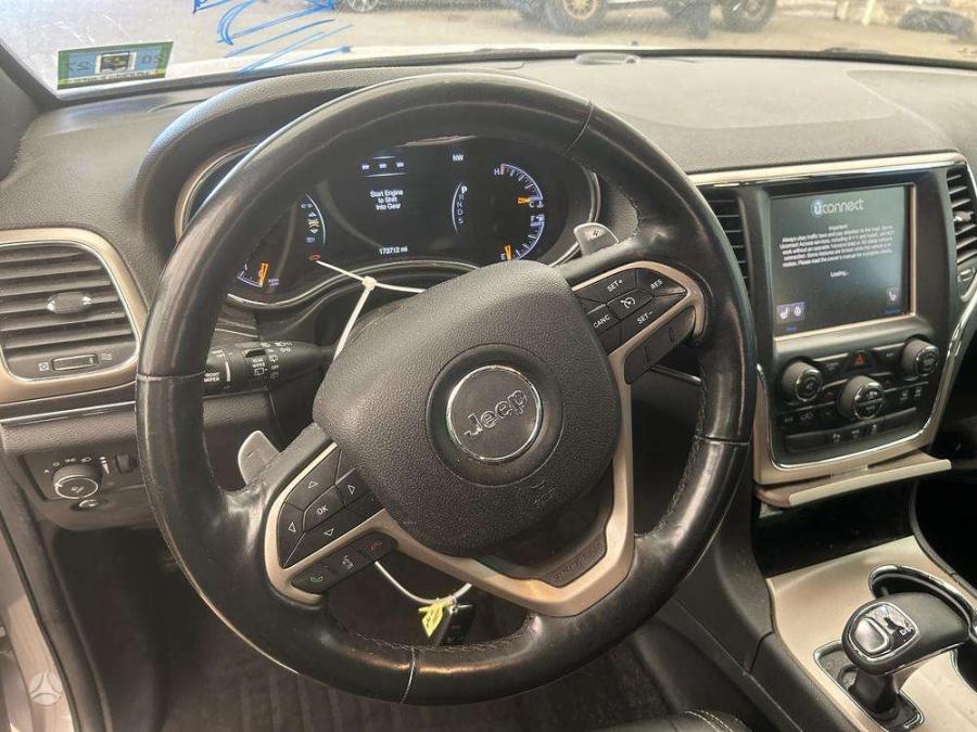 Grey Jeep Grand Cherokee 2014 in Siauliai, with an engine capacity of 3.60 L and mileage of 280 thousand km for 7878 €, photo 16 on AUTOMOTO.COM.LV