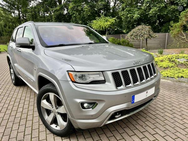 Pelēks Jeep Grand Cherokee 2014 Kauņa, ar dzinēja tilpumu 5.65 L un nobraukumu 211 tūkst. km par 16300 €, foto 1 vietnē AUTOMOTO.COM.LV
