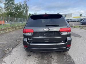 Pelēks Jeep Grand Cherokee 2015 Rīga, ar dzinēja tilpumu 3.00 L un nobraukumu 291 tūkst. km par 10900 €, foto 5 vietnē AUTOMOTO.COM.LV