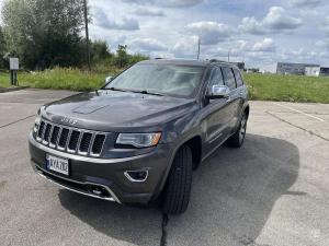 Grey Jeep Grand Cherokee 2015 in Panevezys, with an engine capacity of 5.65 L and mileage of 307 thousand km for 12900 €, photo  on AUTOMOTO.COM.LV