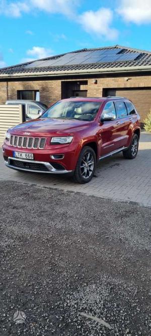 Red Jeep Grand Cherokee 2014 in Kaunas, with an engine capacity of 5.70 L and mileage of 203 thousand km for 14700 €, photo  on AUTOMOTO.COM.LV