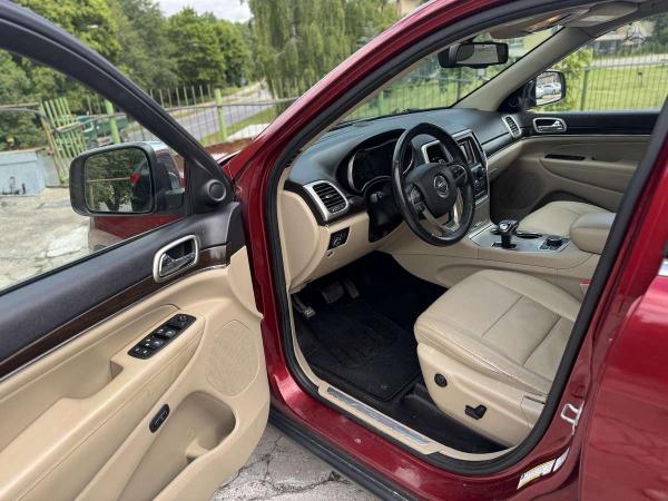 Red Jeep Grand Cherokee 2014 in Vilnius, with an engine capacity of 3.60 L and mileage of 155 thousand km for 13700 €, photo 7 on AUTOMOTO.COM.LV