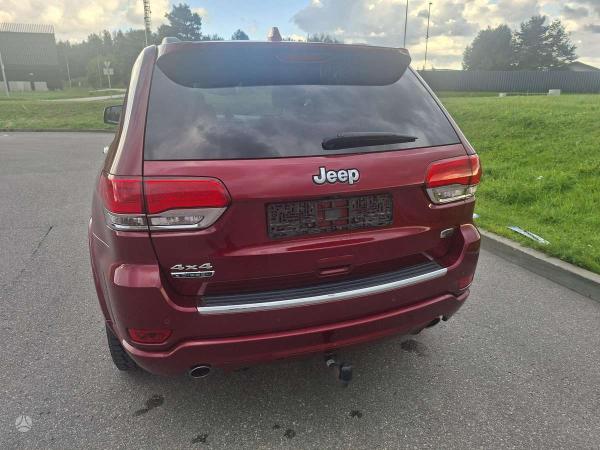 Jeep Grand Cherokee 2015 in Utena on AUTOMOTO.COM.LV Red Jeep Grand Cherokee 2015 in Utena, with an engine capacity of 2.99 L and mileage of 176 thousand km for 12500 €, photo 3 on AUTOMOTO.COM.LV