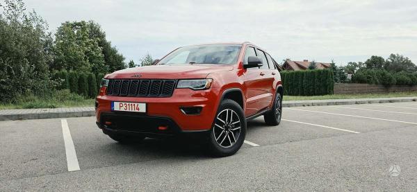 Red Jeep Grand Cherokee 2021 in Klaipeda, with an engine capacity of 3.60 L and mileage of 124 thousand km for 21000 €, photo 1 on AUTOMOTO.COM.LV