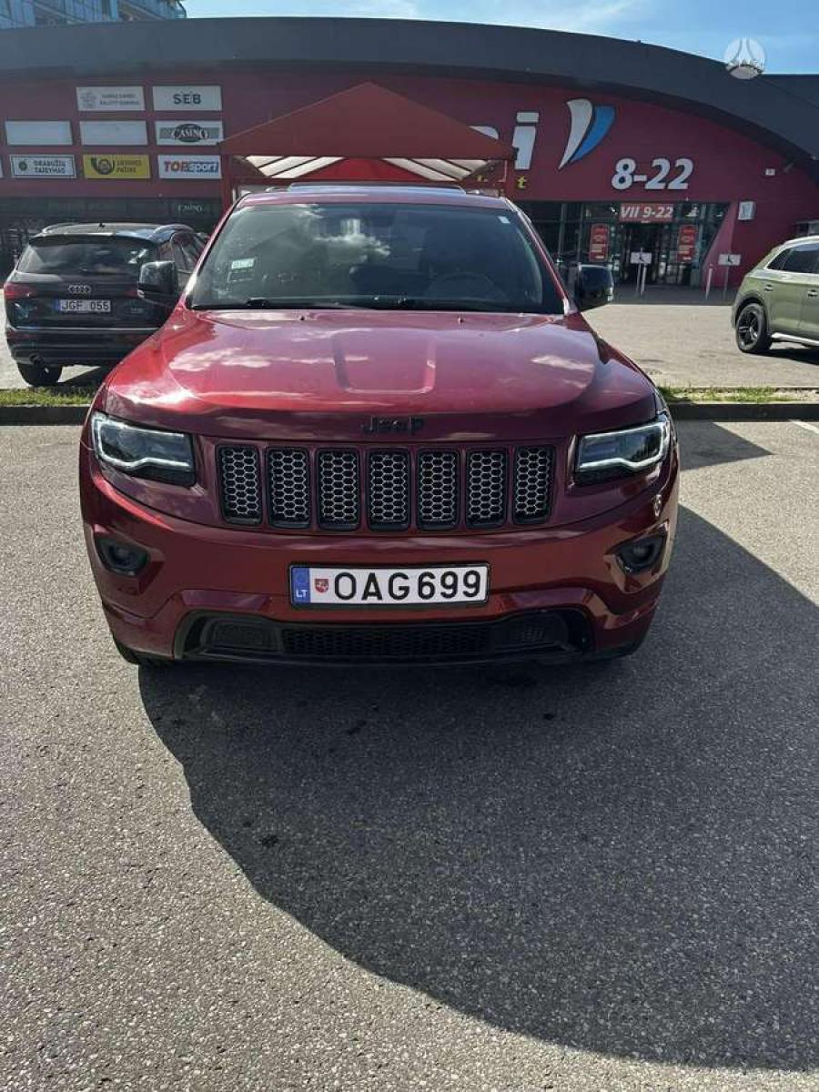 Red Jeep Grand Cherokee 2015 in Vilnius, with an engine capacity of 3.60 L and mileage of 193 thousand km for 14300 €, photo 1 on AUTOMOTO.COM.LV