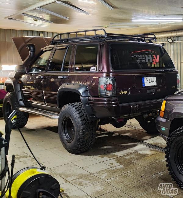 Violet Jeep Grand Cherokee 1996 in Vilnius, with an engine capacity of 5.20 L and mileage of 340 thousand km for 4600 €, photo 1 on AUTOMOTO.COM.LV