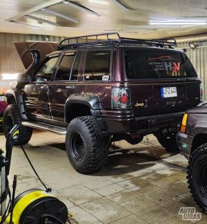 Violet Jeep Grand Cherokee 1996 in Vilnius, with an engine capacity of 5.20 L and mileage of 340 thousand km for 4600 €, photo 1 on AUTOMOTO.COM.LV
