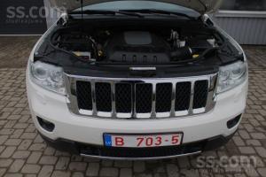 White Jeep Grand Cherokee 2011 in Riga, with an engine capacity of 5.70 L and mileage of 0 thousand km for 12990 €, photo 34 on AUTOMOTO.COM.LV