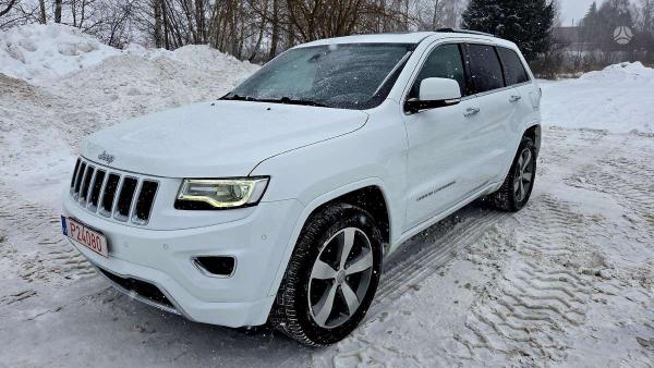 White Jeep Grand Cherokee 2014 in Siauliai, with an engine capacity of 2.99 L and mileage of 128 thousand km for 11900 €, photo 1 on AUTOMOTO.COM.LV