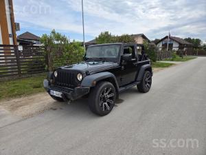 Melns Jeep Wrangler 2011 Rīga, ar dzinēja tilpumu 2.80 L un nobraukumu 199 tūkst. km par 18000 €, foto  vietnē AUTOMOTO.COM.LV