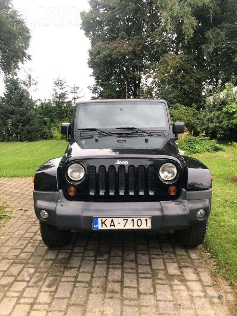 Black Jeep Wrangler 2012 in Riga, with an engine capacity of 2.80 L and mileage of 230 thousand km for 19880 €, photo 1 on AUTOMOTO.COM.LV