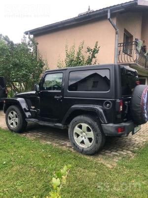 Black Jeep Wrangler 2012 in Riga, with an engine capacity of 2.80 L and mileage of 230 thousand km for 19880 €, photo 4 on AUTOMOTO.COM.LV