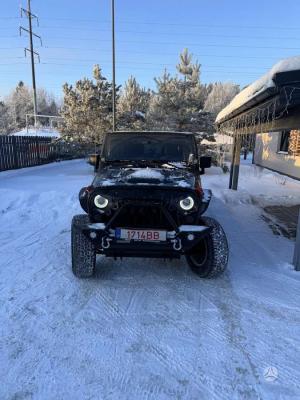 Melns Jeep Wrangler 2014 Viļņa, ar dzinēja tilpumu 3.60 L un nobraukumu 113 tūkst. km par 16500 €, foto  vietnē AUTOMOTO.COM.LV