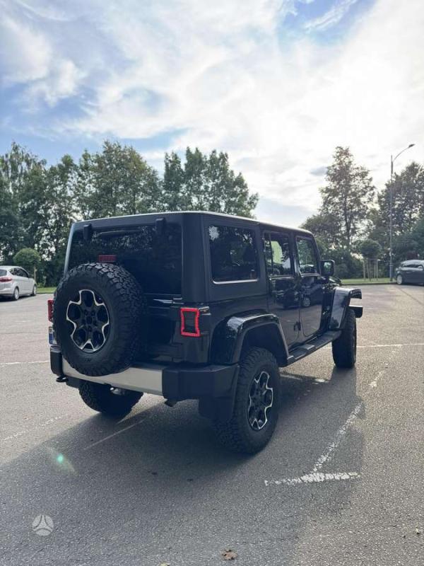 Melns Jeep Wrangler 2015 Tauragė, ar dzinēja tilpumu 3.60 L un nobraukumu 155 tūkst. km par 15450 €, foto 3 vietnē AUTOMOTO.COM.LV