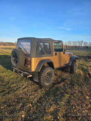 Brūns Jeep Wrangler 1997 Tallina, ar dzinēja tilpumu 5.20 L un nobraukumu 147 tūkst. km par 31000 €, foto 3 vietnē AUTOMOTO.COM.LV
