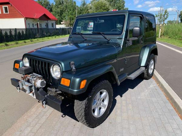 Green Jeep Wrangler 2004 in Riga, with an engine capacity of 3.96 L and mileage of 210 thousand km for 14900 €, photo 4 on AUTOMOTO.COM.LV