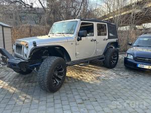 Grey Jeep Wrangler 2012 in Riga, with an engine capacity of 3.60 L and mileage of 170 thousand km for 16000 €, photo 11 on AUTOMOTO.COM.LV