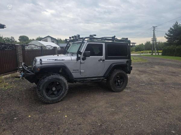 Pelēks Jeep Wrangler 2013 Viļņa, ar dzinēja tilpumu 3.60 L un nobraukumu 160 tūkst. km par 15700 €, foto 1 vietnē AUTOMOTO.COM.LV