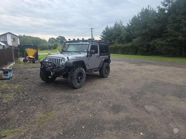 Pelēks Jeep Wrangler 2013 Viļņa, ar dzinēja tilpumu 3.60 L un nobraukumu 160 tūkst. km par 15700 €, foto 4 vietnē AUTOMOTO.COM.LV