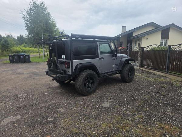 Pelēks Jeep Wrangler 2013 Viļņa, ar dzinēja tilpumu 3.60 L un nobraukumu 160 tūkst. km par 15700 €, foto 5 vietnē AUTOMOTO.COM.LV