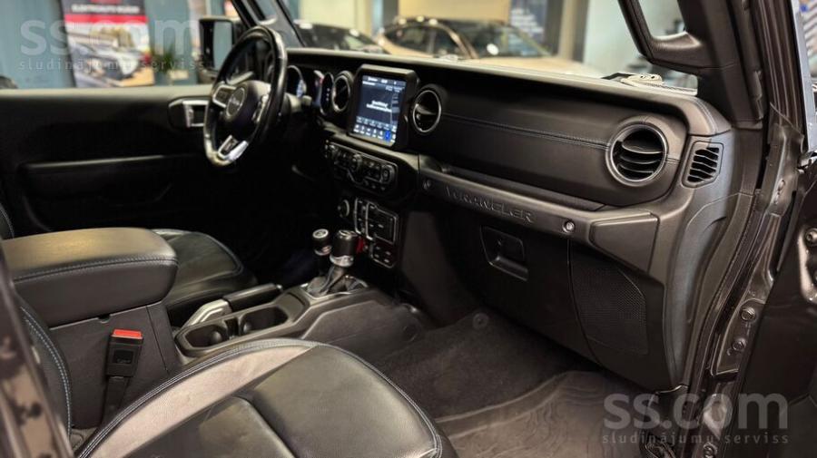 Grey Jeep Wrangler 2022 in Riga, with an engine capacity of 2.00 L and mileage of 85 thousand km for 69900 €, photo 18 on AUTOMOTO.COM.LV