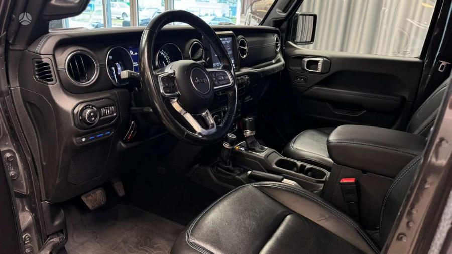 Grey Jeep Wrangler 2022 in Riga, with an engine capacity of 2.00 L and mileage of 85 thousand km for 69990 €, photo 9 on AUTOMOTO.COM.LV
