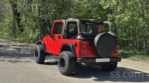 Red Jeep Wrangler 2005 in Riga, with an engine capacity of 4.00 L and mileage of 121 thousand km for 10500 €, photo 7 on AUTOMOTO.COM.LV