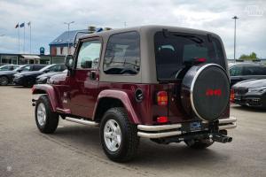 Sarkans Jeep Wrangler 2003 Marijampole, ar dzinēja tilpumu 4.00 L un nobraukumu 22 tūkst. km par 18850 €, foto 10 vietnē AUTOMOTO.COM.LV