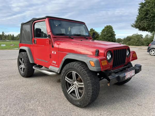 Sarkans Jeep Wrangler 2003 Grobiņa, ar dzinēja tilpumu 4.00 L un nobraukumu 280 tūkst. km par 12000 €, foto 3 vietnē AUTOMOTO.COM.LV