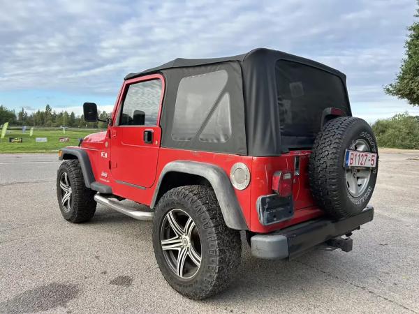 Sarkans Jeep Wrangler 2003 Grobiņa, ar dzinēja tilpumu 4.00 L un nobraukumu 280 tūkst. km par 12000 €, foto 4 vietnē AUTOMOTO.COM.LV