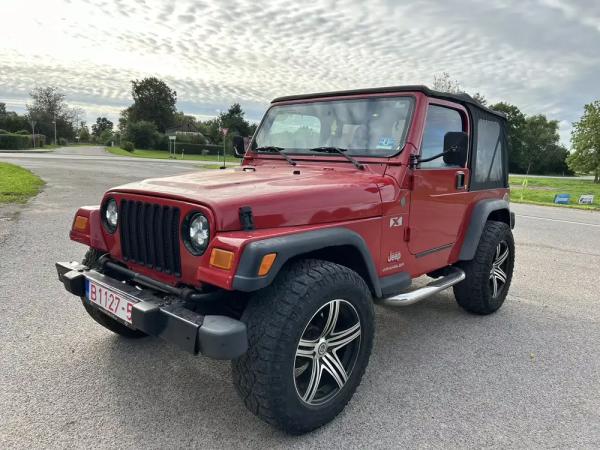 Sarkans Jeep Wrangler 2003 Grobiņa, ar dzinēja tilpumu 4.00 L un nobraukumu 280 tūkst. km par 12000 €, foto 5 vietnē AUTOMOTO.COM.LV