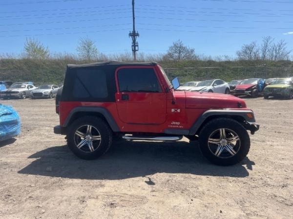 Red Jeep Wrangler 2003 in Riga, with an engine capacity of 4.00 L and mileage of 280 thousand km for 12000 €, photo 6 on AUTOMOTO.COM.LV