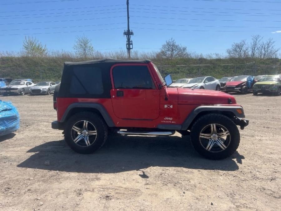 Red Jeep Wrangler 2003 in Riga, with an engine capacity of 4.00 L and mileage of 280 thousand km for 12000 €, photo 7 on AUTOMOTO.COM.LV