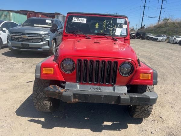 Red Jeep Wrangler 2003 in Riga, with an engine capacity of 4.00 L and mileage of 280 thousand km for 12000 €, photo 7 on AUTOMOTO.COM.LV