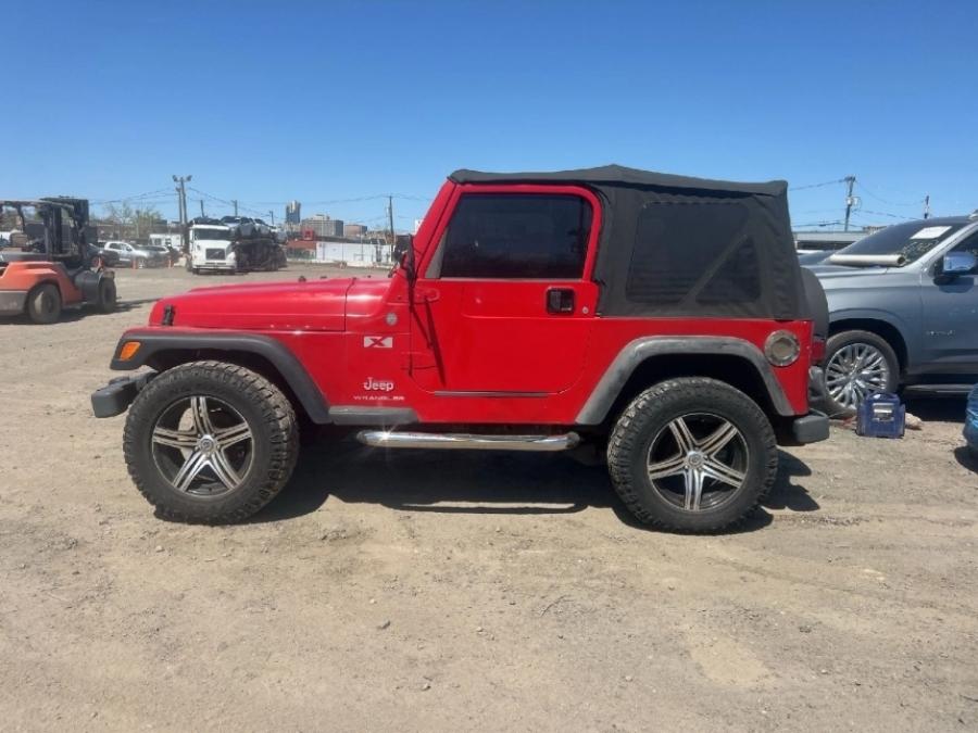 Red Jeep Wrangler 2003 in Riga, with an engine capacity of 4.00 L and mileage of 280 thousand km for 12000 €, photo 9 on AUTOMOTO.COM.LV
