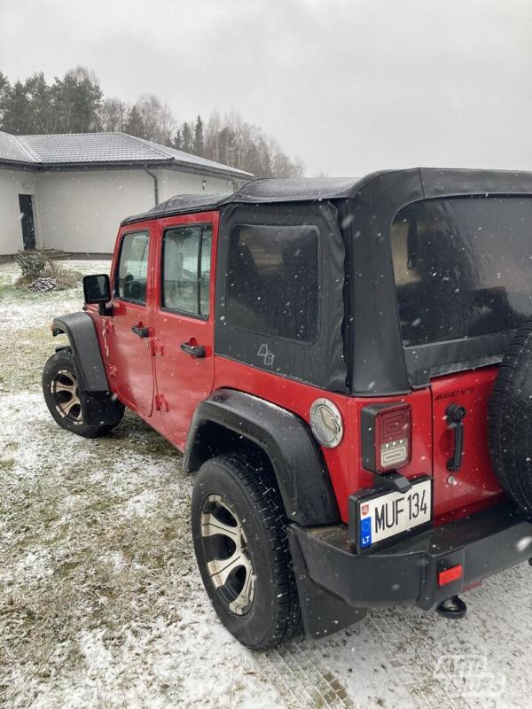 Sarkans Jeep Wrangler 2013 Jonava, ar dzinēja tilpumu 3.60 L un nobraukumu 268 tūkst. km par 16000 €, foto 6 vietnē AUTOMOTO.COM.LV