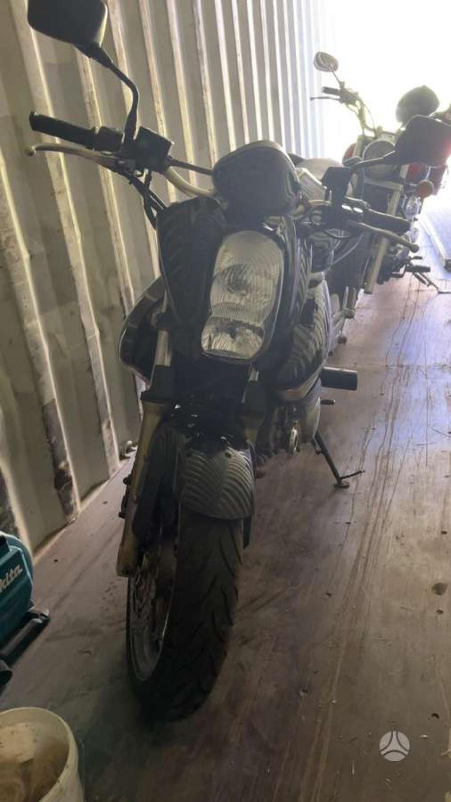 Black Kawasaki ER 2006 in Utena, with an engine capacity of 0.65 L and mileage of 40 thousand km for 2500 €, photo 4 on AUTOMOTO.COM.LV