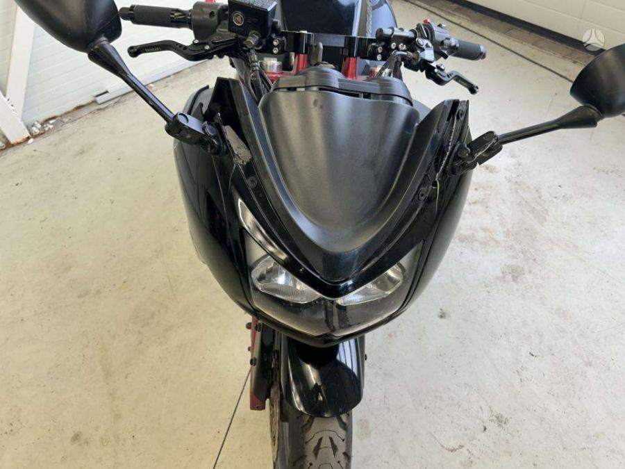 Black Kawasaki ER 2007 in Radviliskis, with an engine capacity of 0.65 L and mileage of 63 thousand km for 1650 €, photo 18 on AUTOMOTO.COM.LV