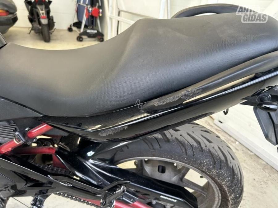 Black Kawasaki ER 2007 in Radviliskis, with an engine capacity of 0.65 L and mileage of 63 thousand km for 1650 €, photo 14 on AUTOMOTO.COM.LV