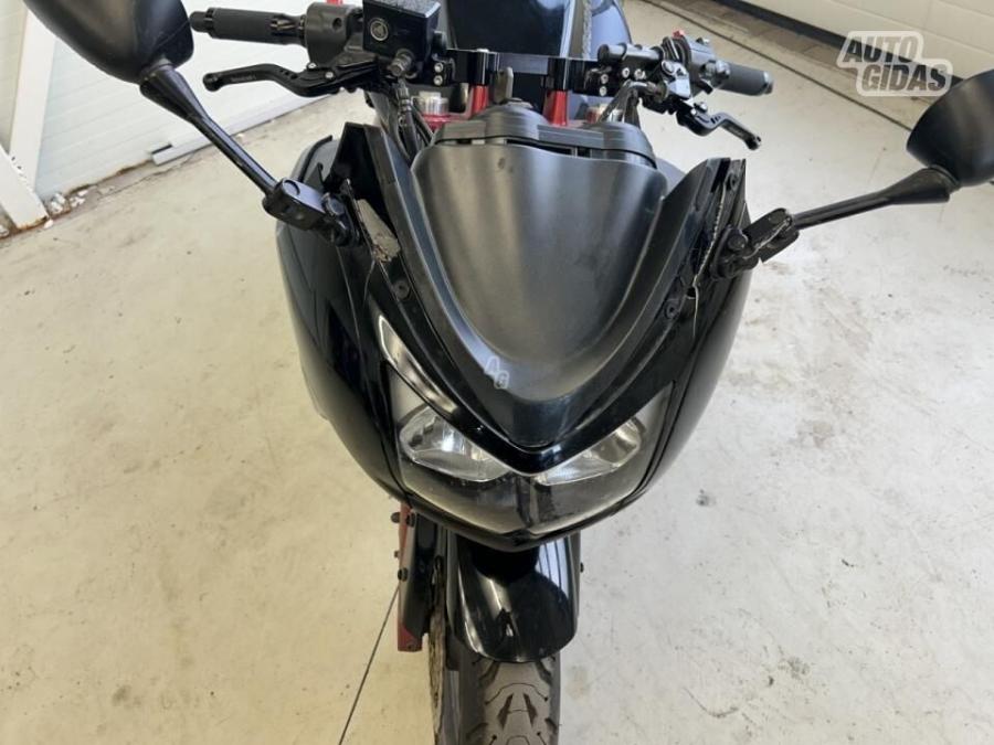 Black Kawasaki ER 2007 in Radviliskis, with an engine capacity of 0.65 L and mileage of 63 thousand km for 1650 €, photo 18 on AUTOMOTO.COM.LV